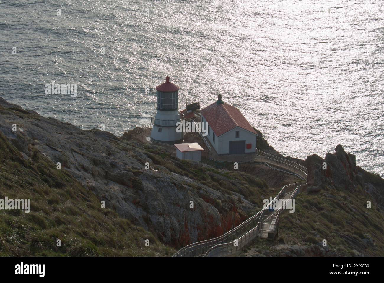 Sun setting over the ocean illuminating Point Reyes Lighthouse Stock ...