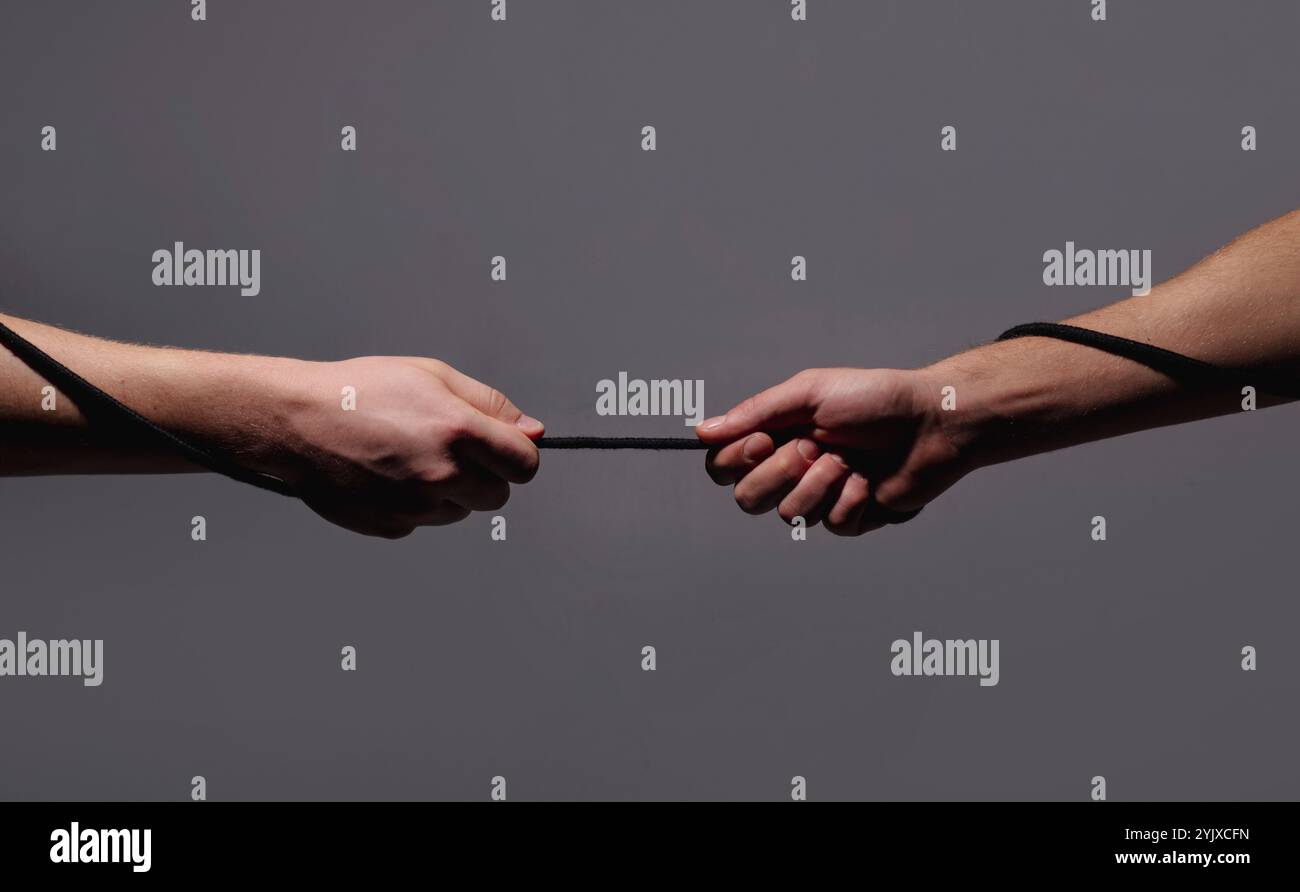 Support hands. Hand of support. Rescue, help, helping gesture or hands. Tug of war. Rope, cord ...