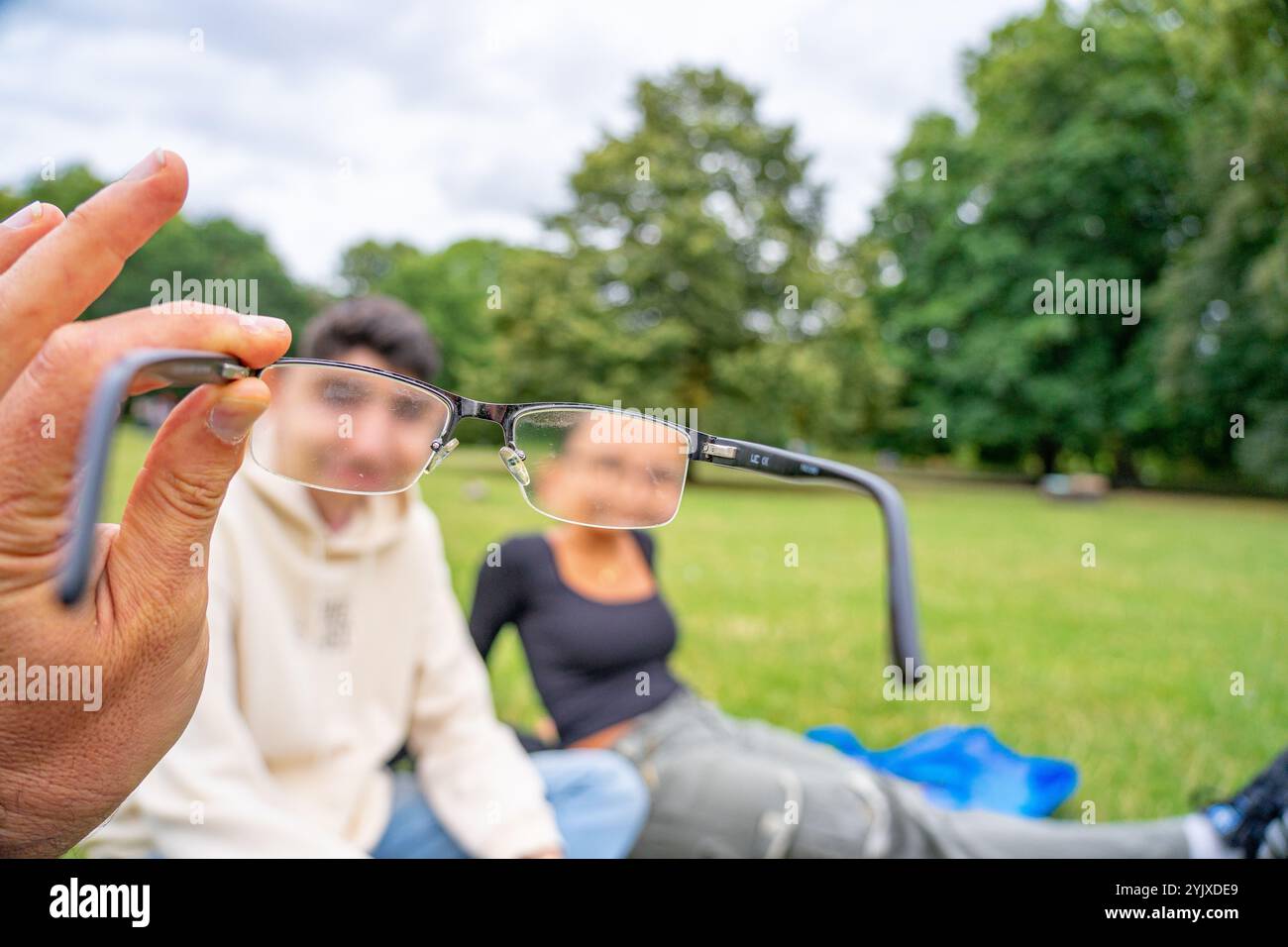 unrecognizable and deformed faces seen through corrective glasses.UK Stock Photo - Alamy