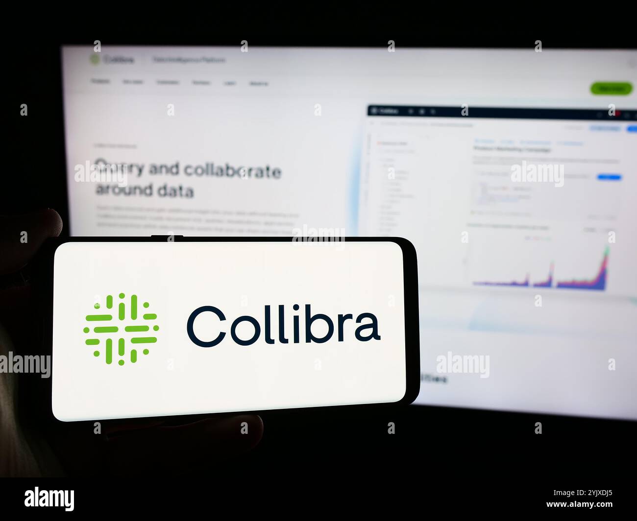 In this photo illustration, a person is holding a mobile phone with the ...