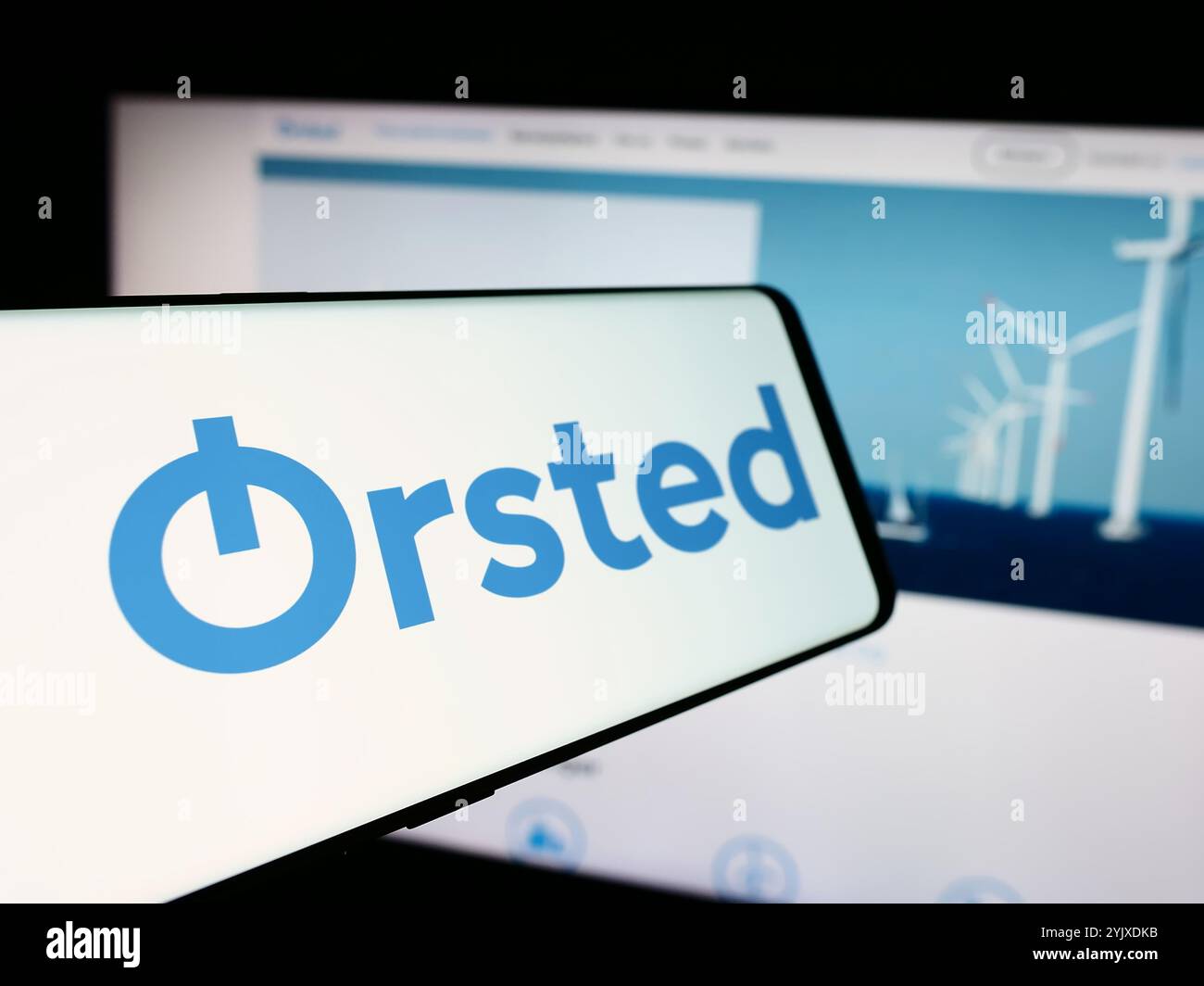 In this photo illustration, a mobile phone with the logo of Danish wind ...