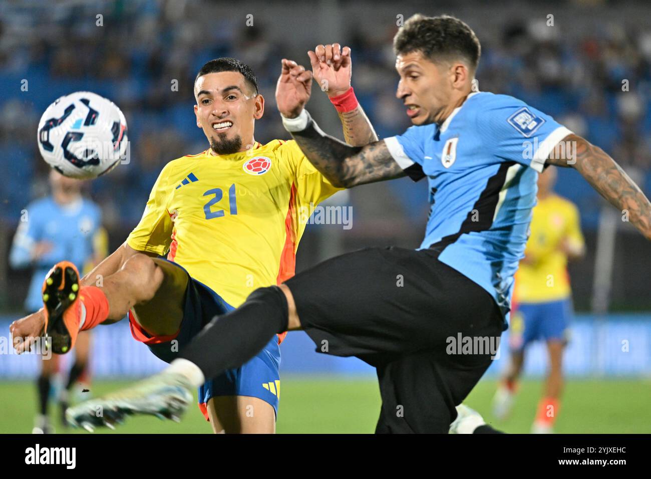 Colombia's Daniel Munoz (21) and Uruguay's Mathias Olivera battle for the ball during a ...