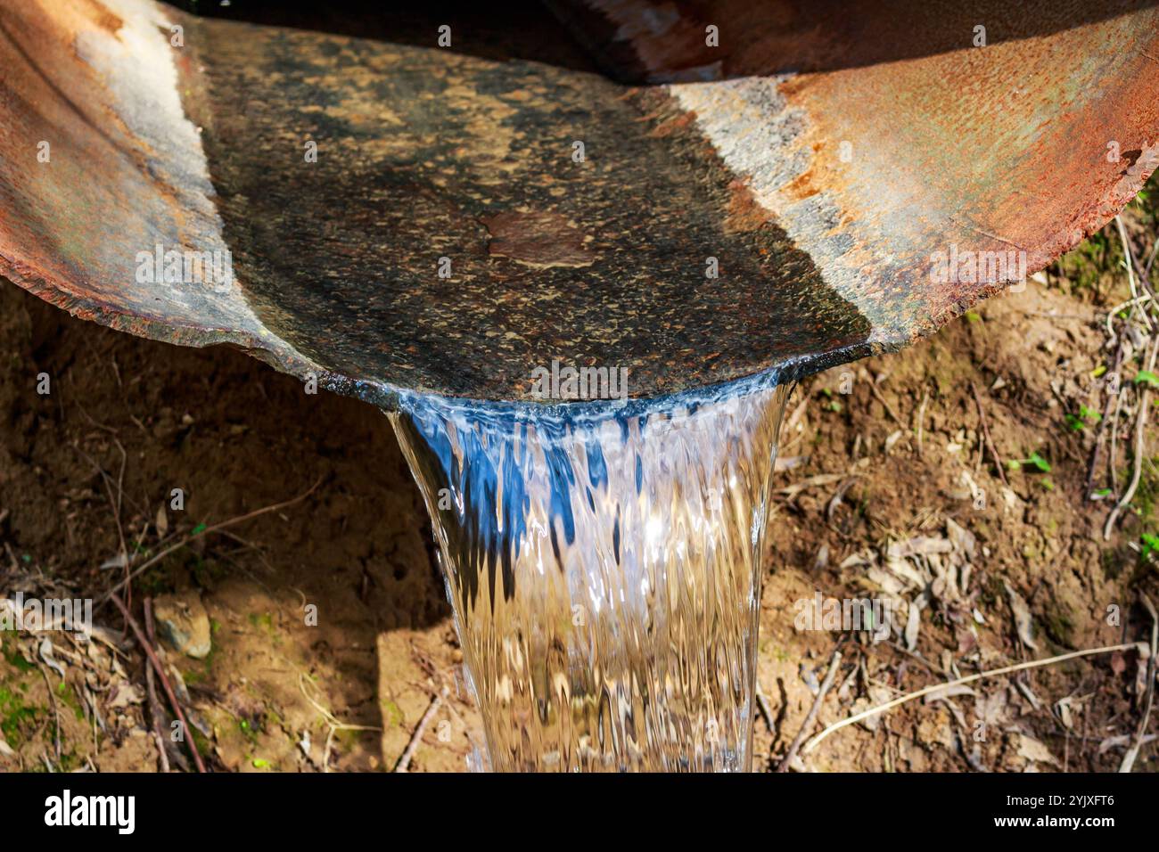 Clear water flows through a large diameter iron pipe Stock Photo - Alamy