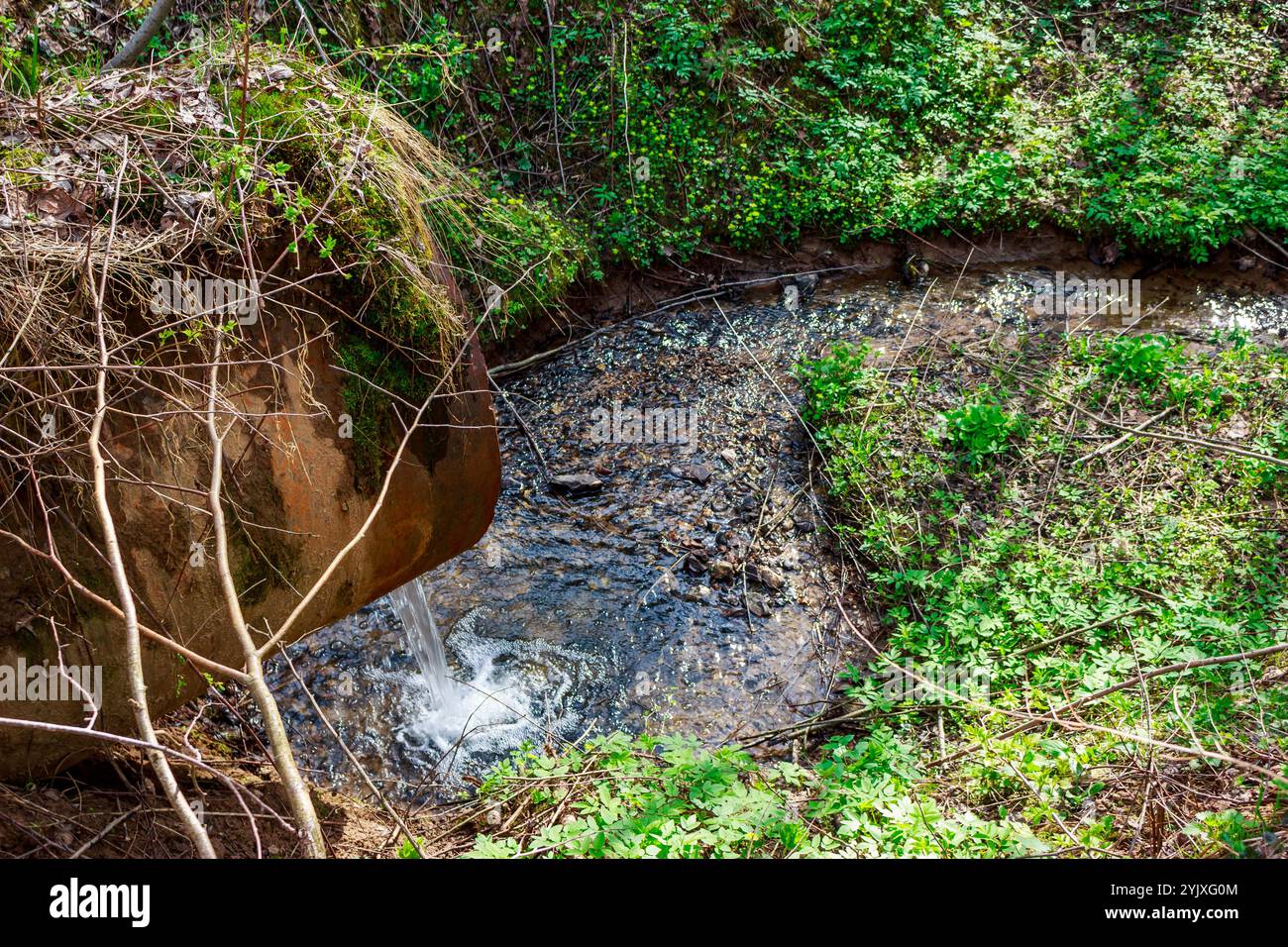 Spring water flows out pipe hi-res stock photography and images - Alamy