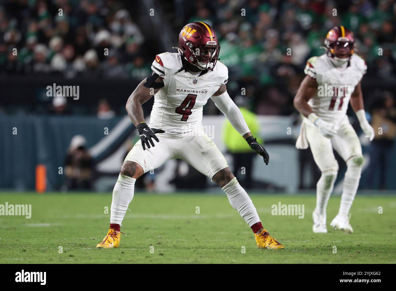 Washington Commanders linebacker Frankie Luvu (4) protects the edge ...