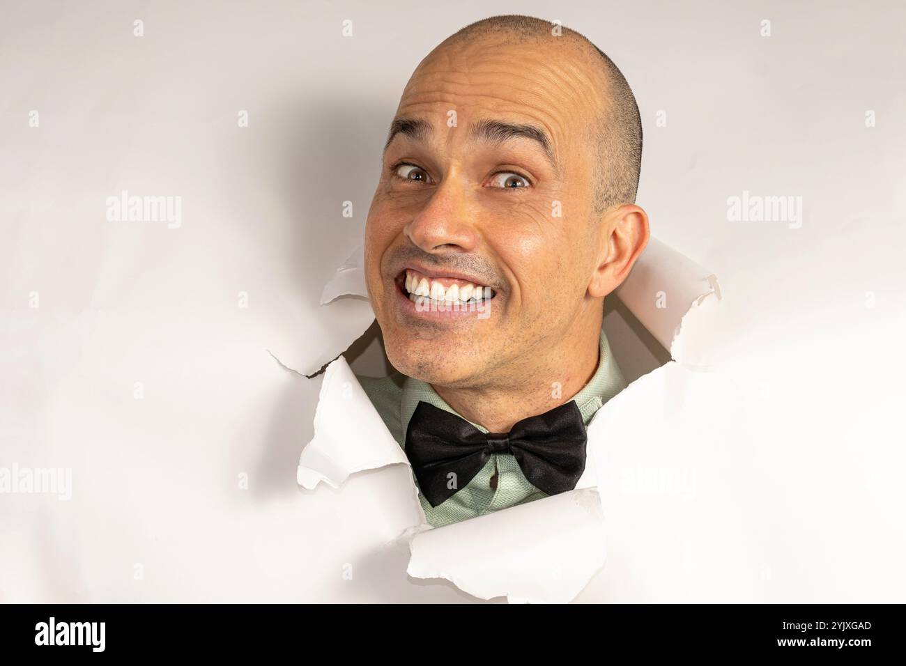 48 year old man in casual clothing and a bow tie, with only his head on ...