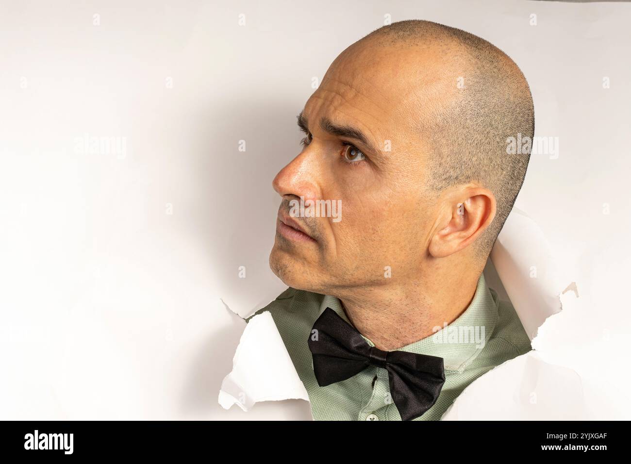 48 year old man in casual clothing and a bow tie, with only his head on ...