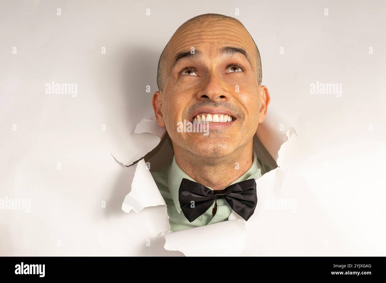 48 year old man in casual clothing and a bow tie, with only his head on ...