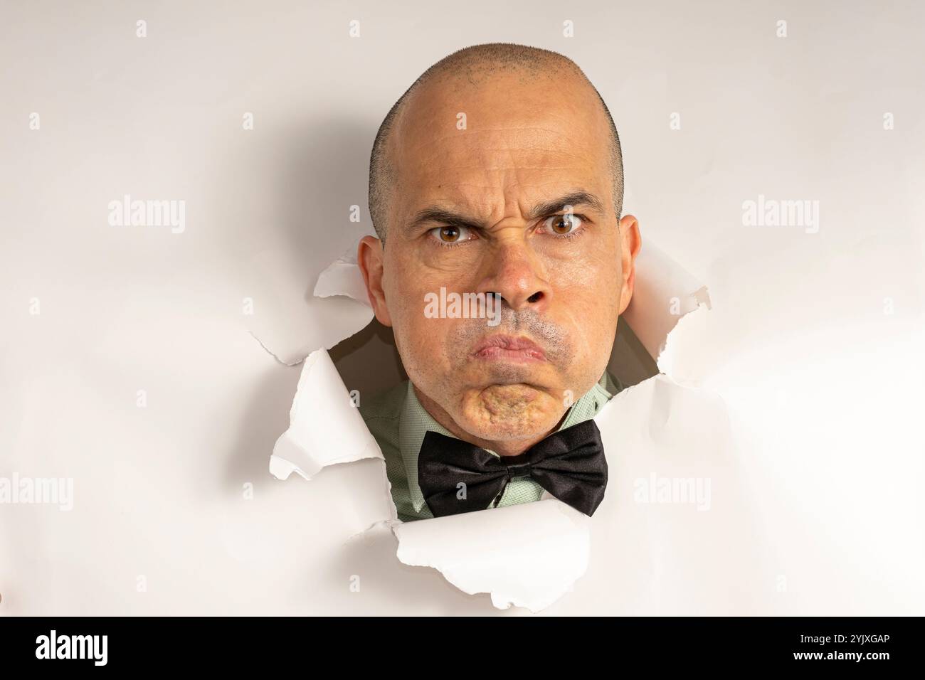 48 year old man in casual clothing and a bow tie, with only his head on ...