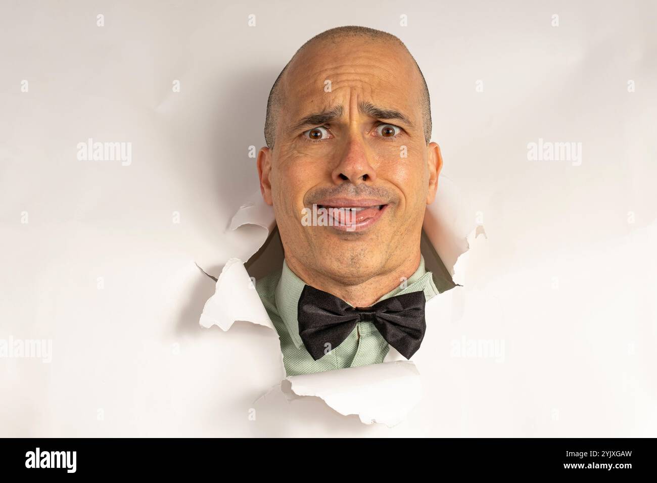 48 year old man in casual clothing and a bow tie, with only his head on ...