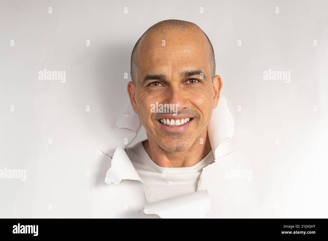 48 year old Brazilian man in casual clothes, only his head on a torn ...