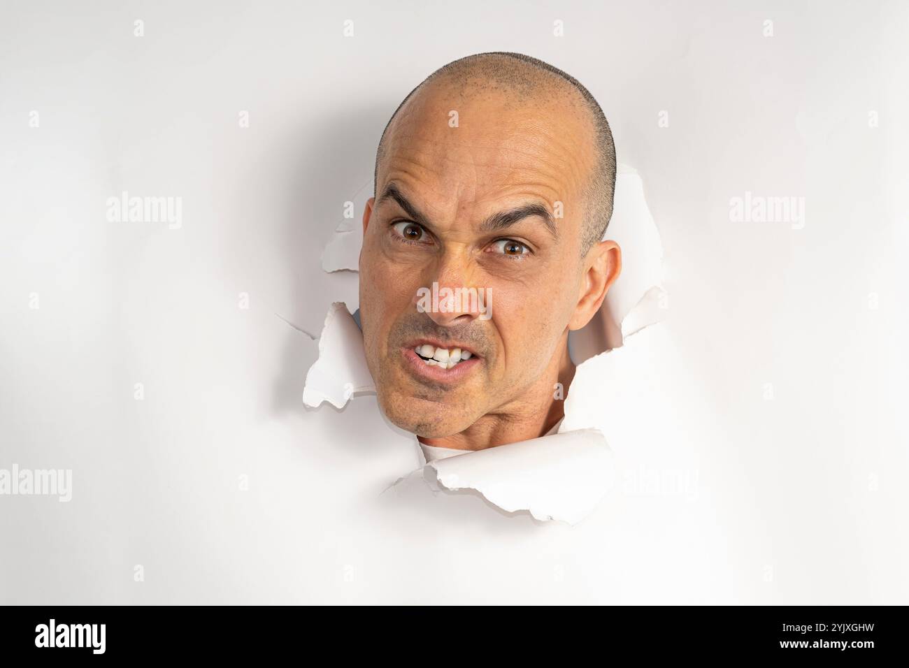 48 year old Brazilian man in casual clothes, only his head on a torn ...