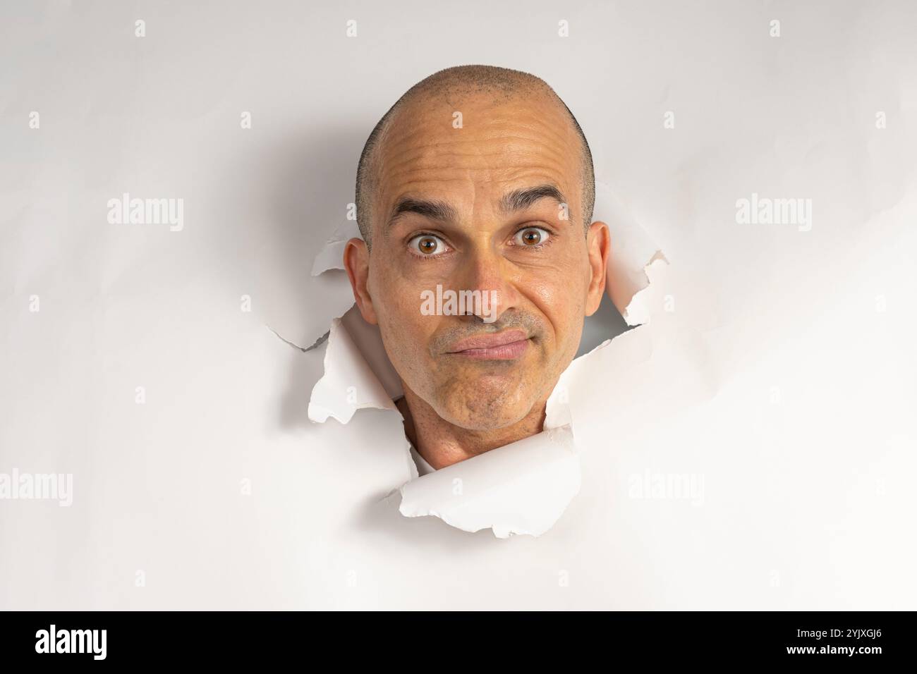 48 year old Brazilian man in casual clothes, only his head on a torn ...