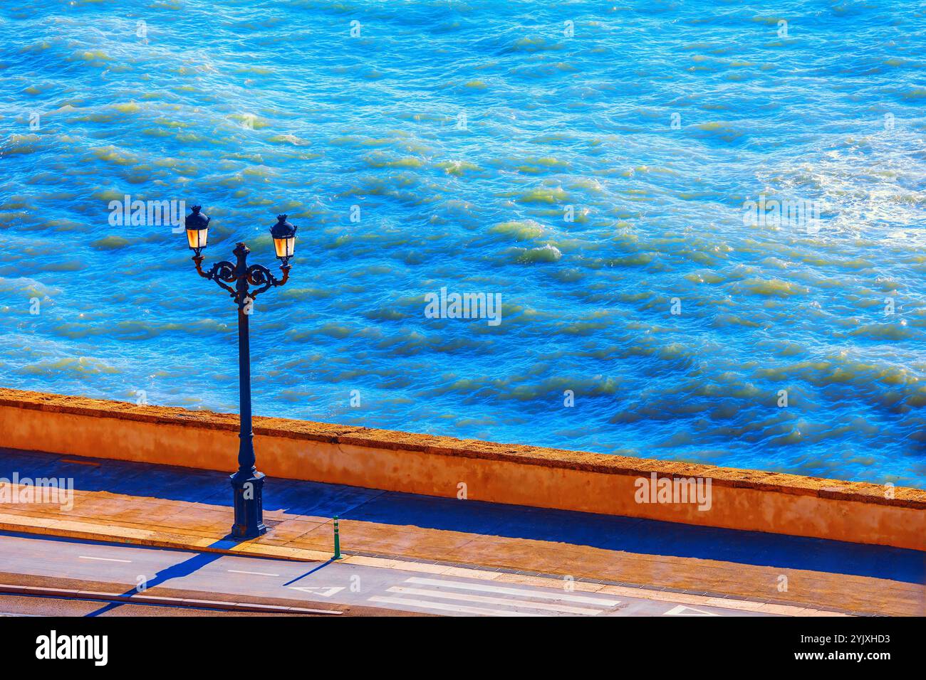 Scenic waterfront view featuring a dynamic sea water with shades of ...