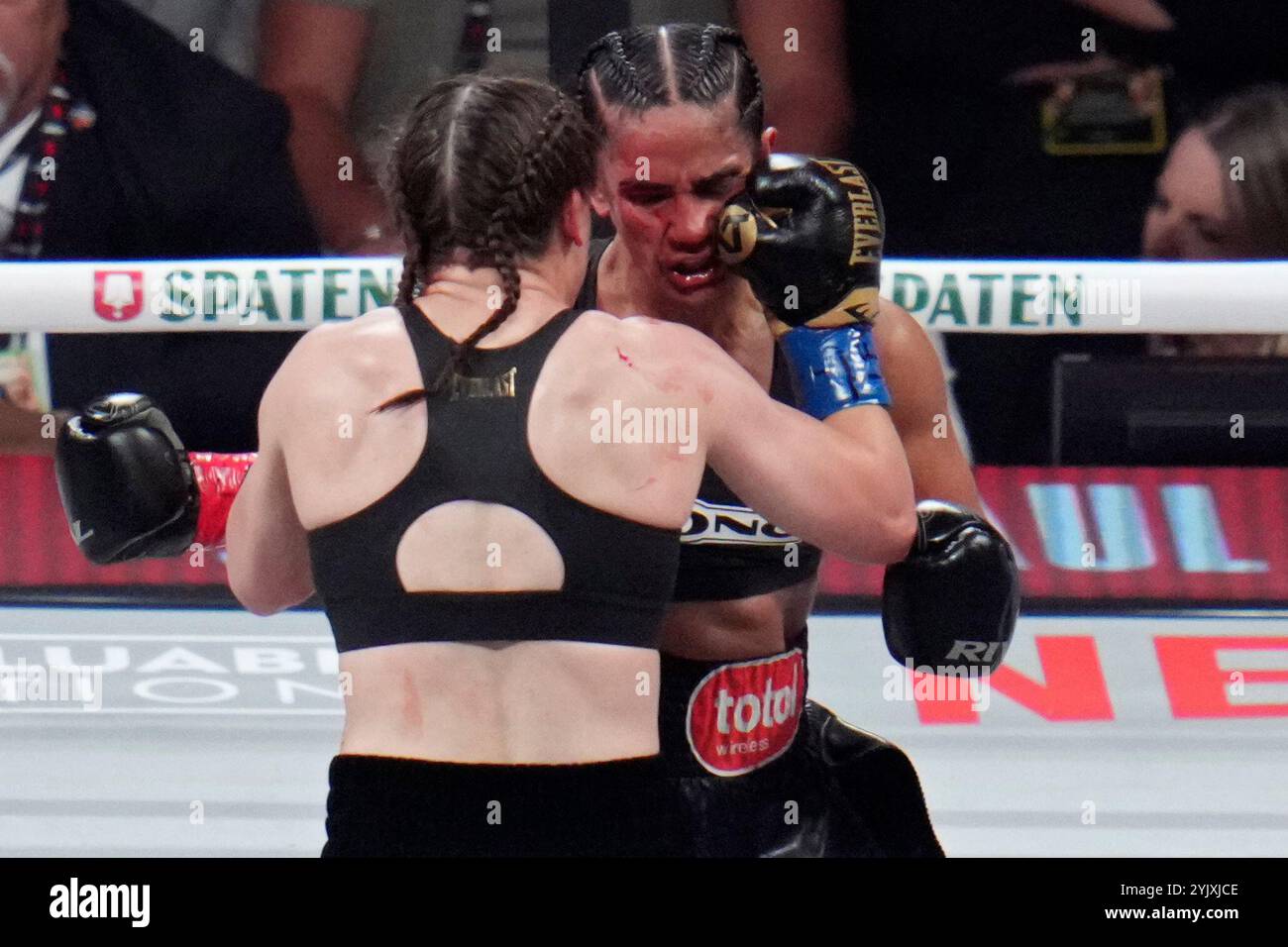 Katie Taylor, left, hits Amanda Serrano during their undisputed super ...