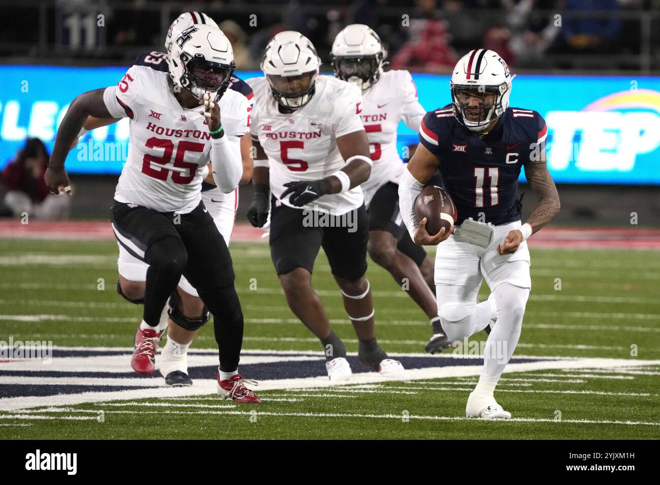 Arizona quarterback Noah Fifita runs past Houston linebacker Jamal ...