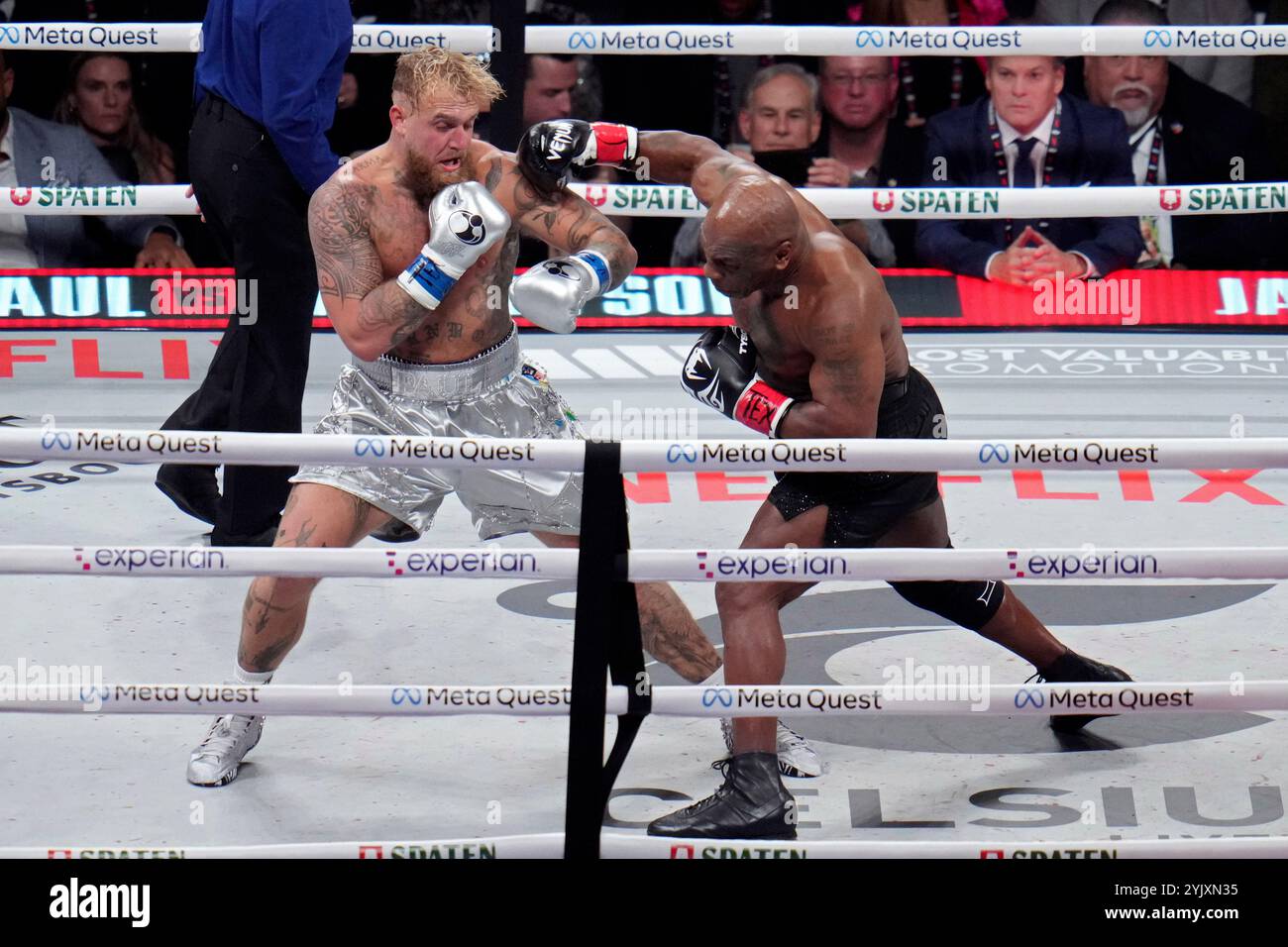 Mike Tyson throws a right at Jake Paul during their heavyweight boxing ...