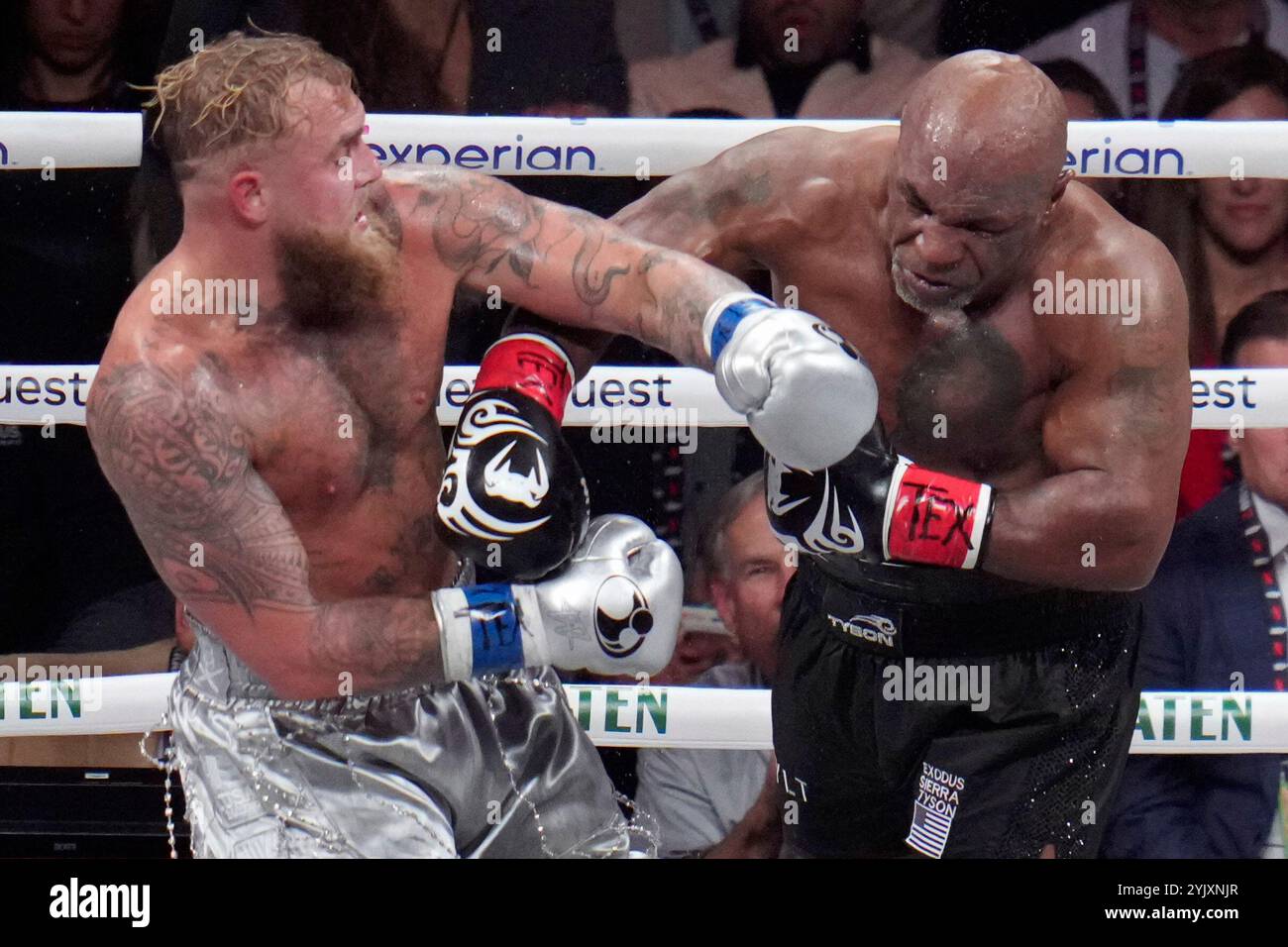 Jake Paul, left, fights Mike Tyson during their heavyweight boxing ...
