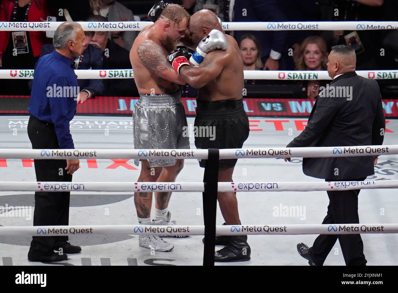 Jake Paul, left, and Mike Tyson embrace after their heavyweight boxing ...