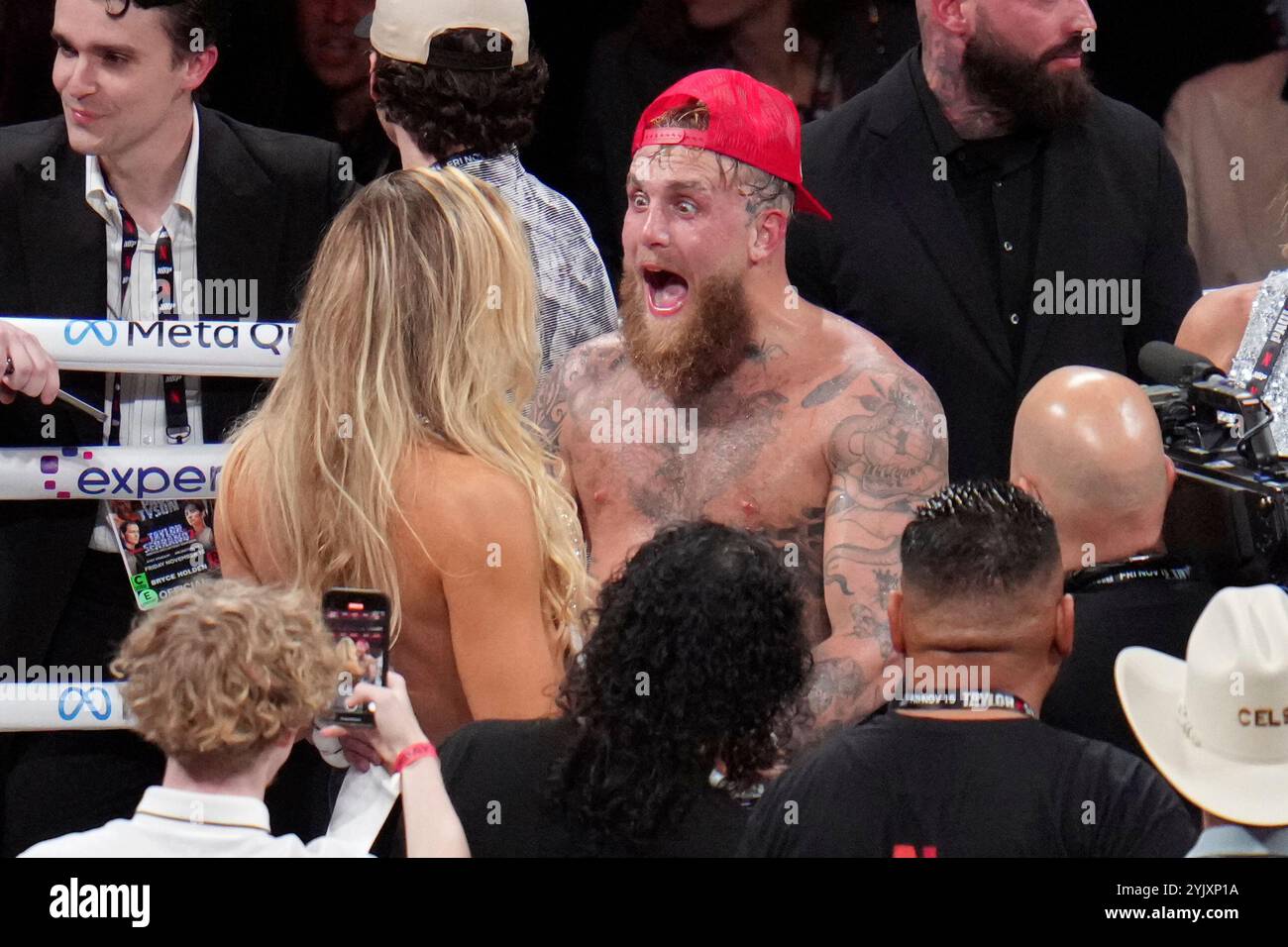 Jake Paul reacts after defeating Mike Tyson during their heavyweight ...