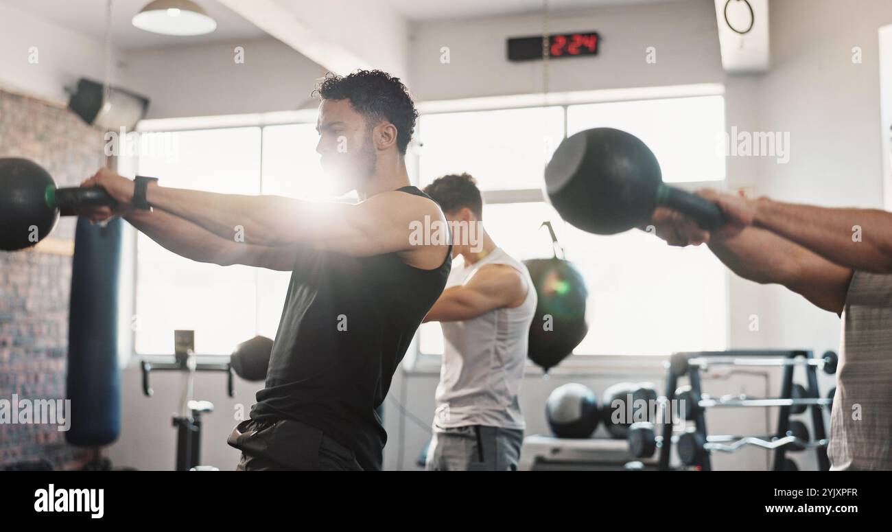 Fitness, kettle bells and men in gym with weights for bodybuilding ...