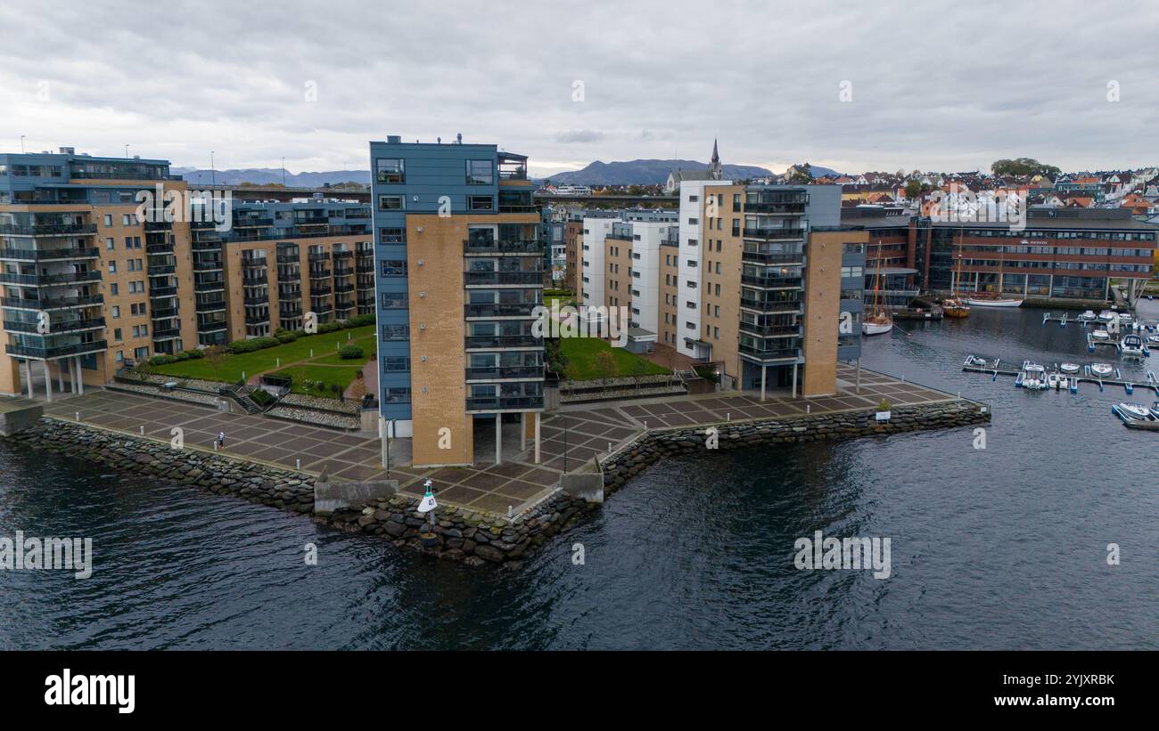 Aerial view of modern waterfront apartment buildings with a marina ...