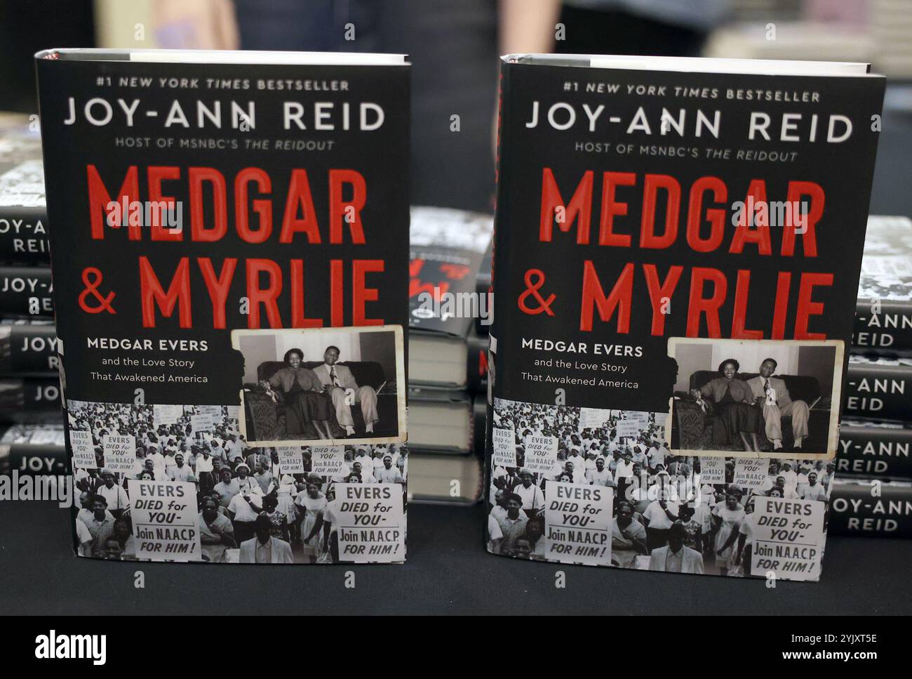 Copies of author Joy-Ann Reid’s book, “Medgar and Merle” are on display ...