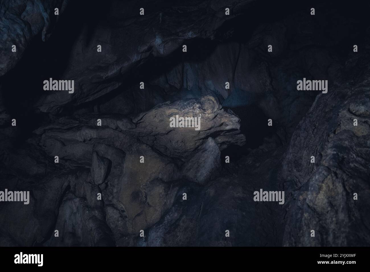 A stone in the Bukit Buntu Kesu Tana Toraja cave is shaped like a large ...
