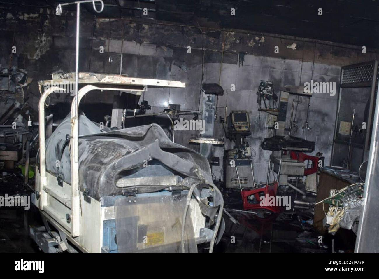 Equipment damaged by fire lies inside a neonatal intensive care unit at ...