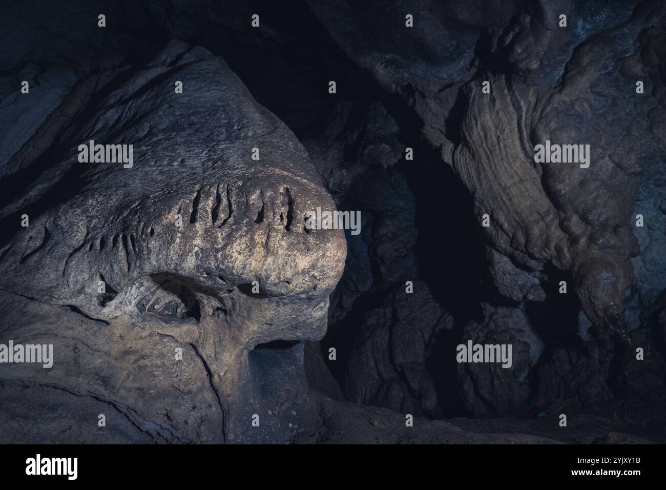 A stone in the Bukit Buntu Kesu Tana Toraja cave is in the shape of a ...