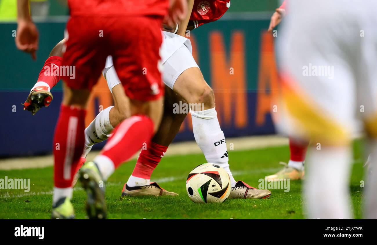 Feature, legs and ball, fight, action, game ball, football U-21 ...