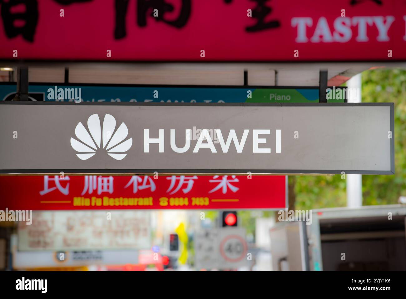 The corporate logo and name of the Chinese communications giant, Huawei ...