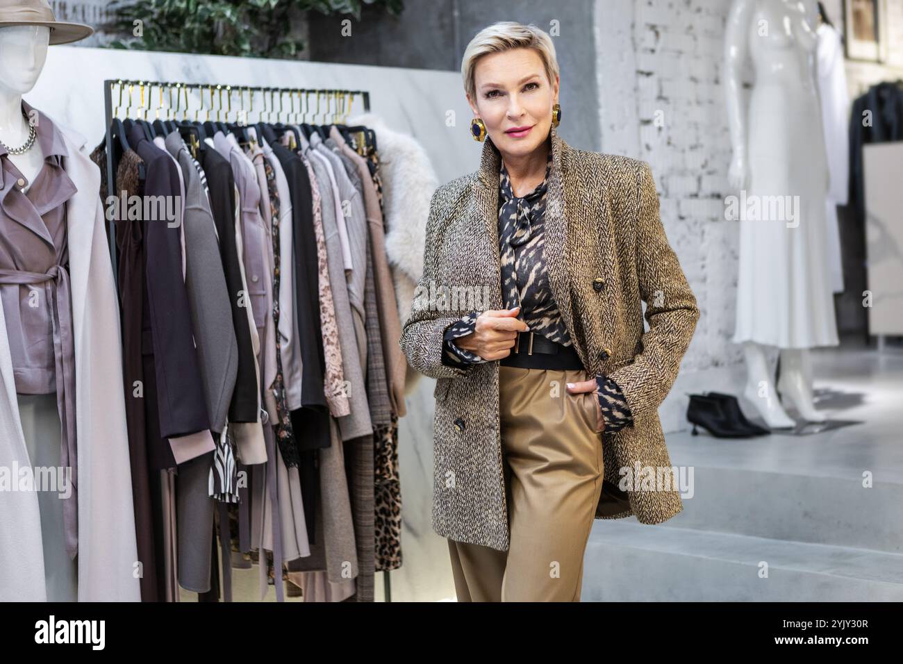 Stylish Mature Woman with Short Hair in Fashionable Clothing Standing ...