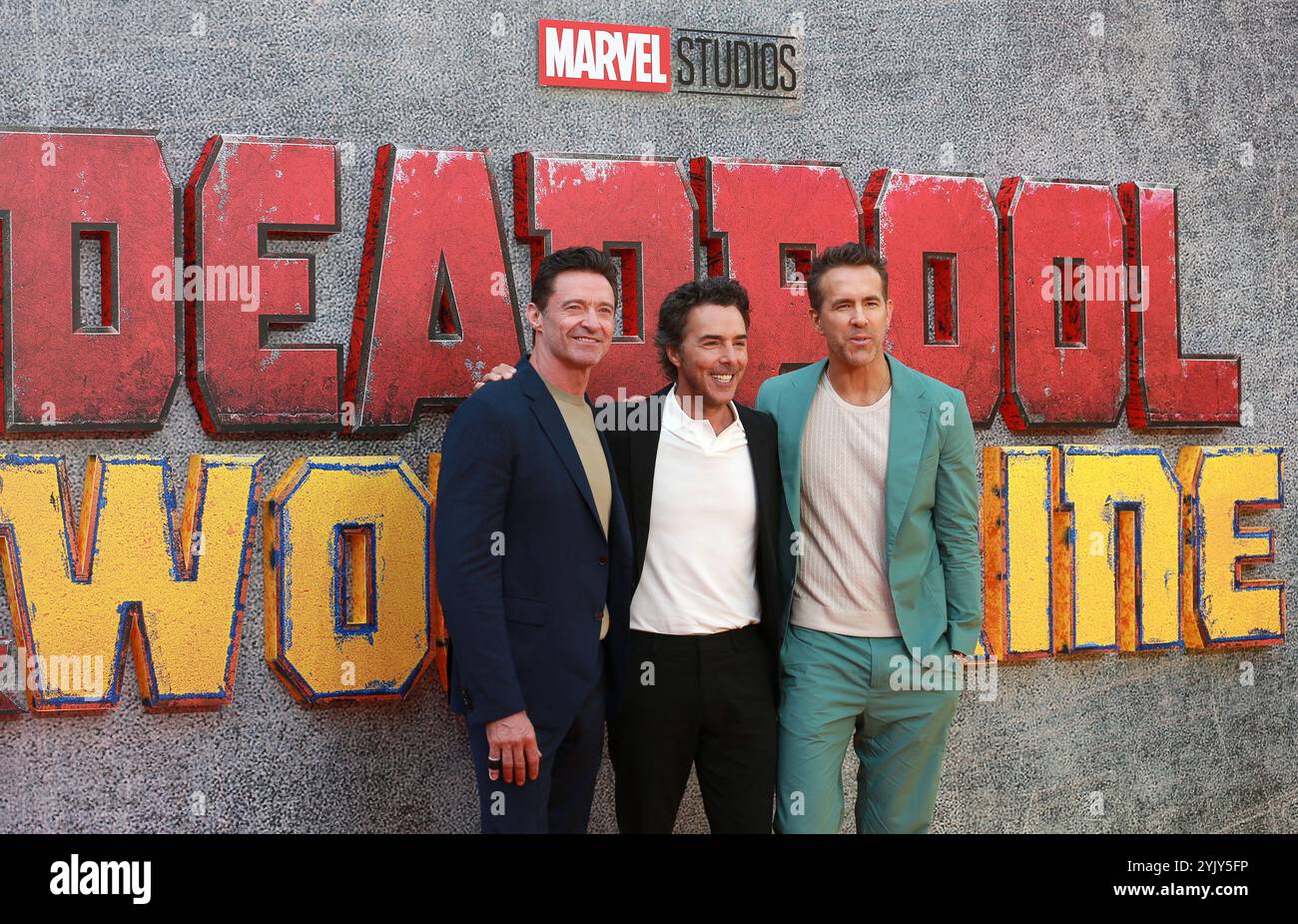 Hugh Jackman, Shawn Levy and Ryan Reynolds attend the "Deadpool & Wolverine" UK Fan Event at the ...