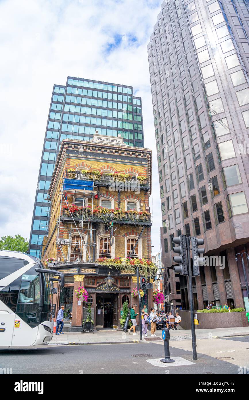 The Albert, an ancient building next to modern buildings during the day ...