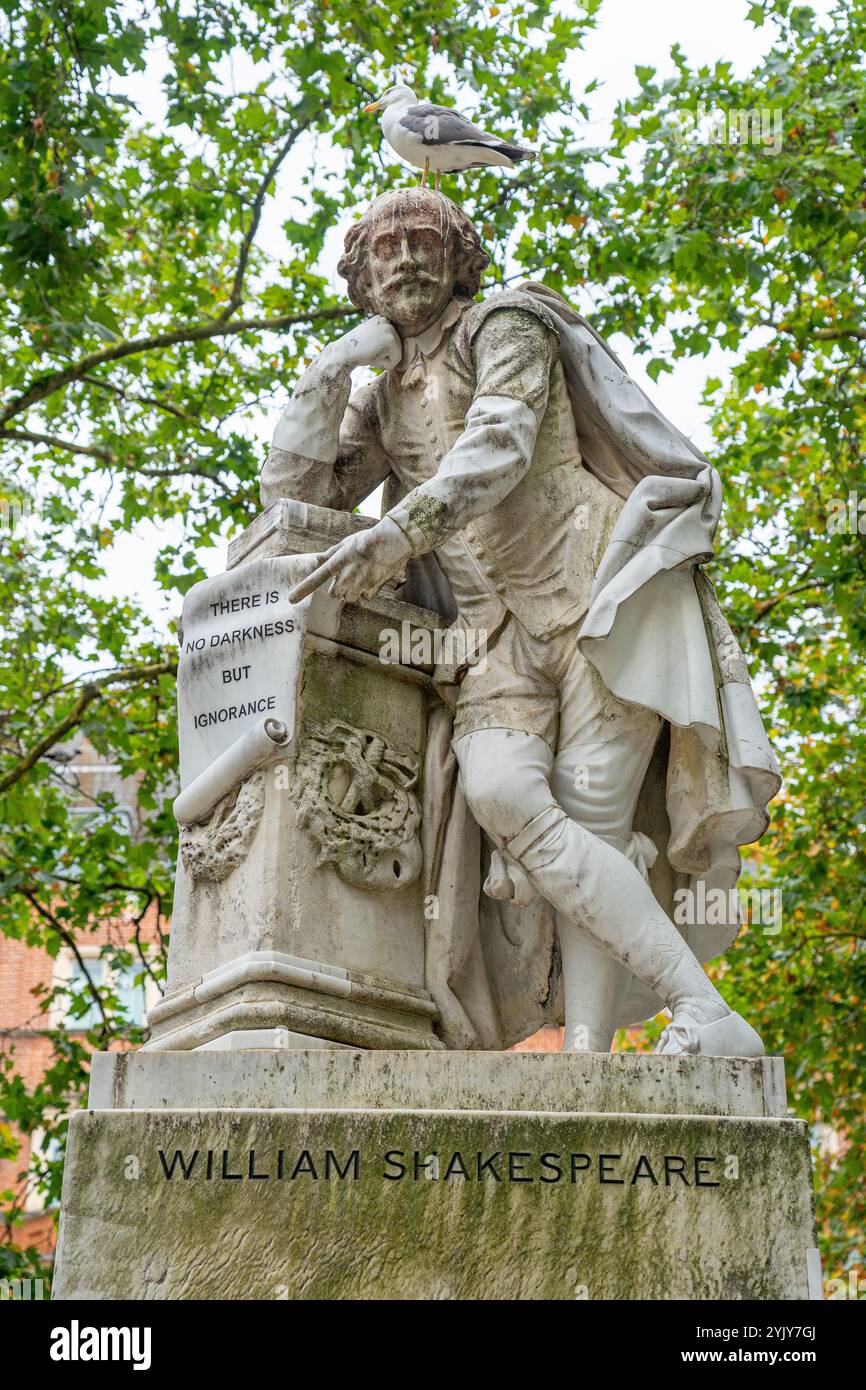 statue in honor of William Shakespeare in a park in central London ...