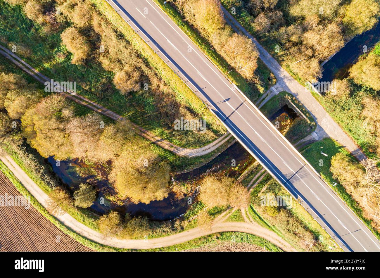 zenithal view with drone of a bridge on a secondary road over a river ...