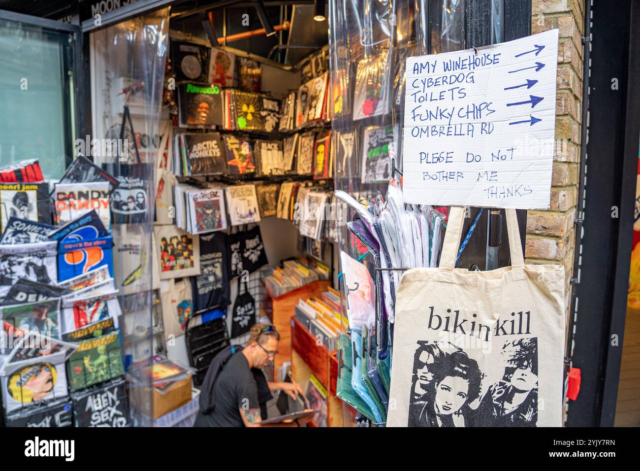 store with information sign with direction signs to points of interest ...
