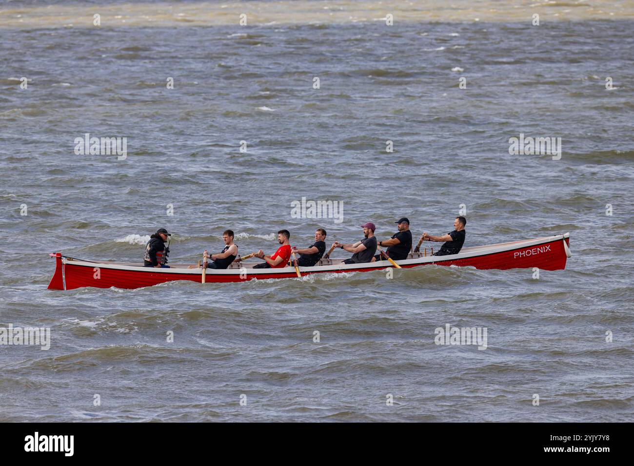 Pilot gig racing off Clevedon beach Stock Photo - Alamy