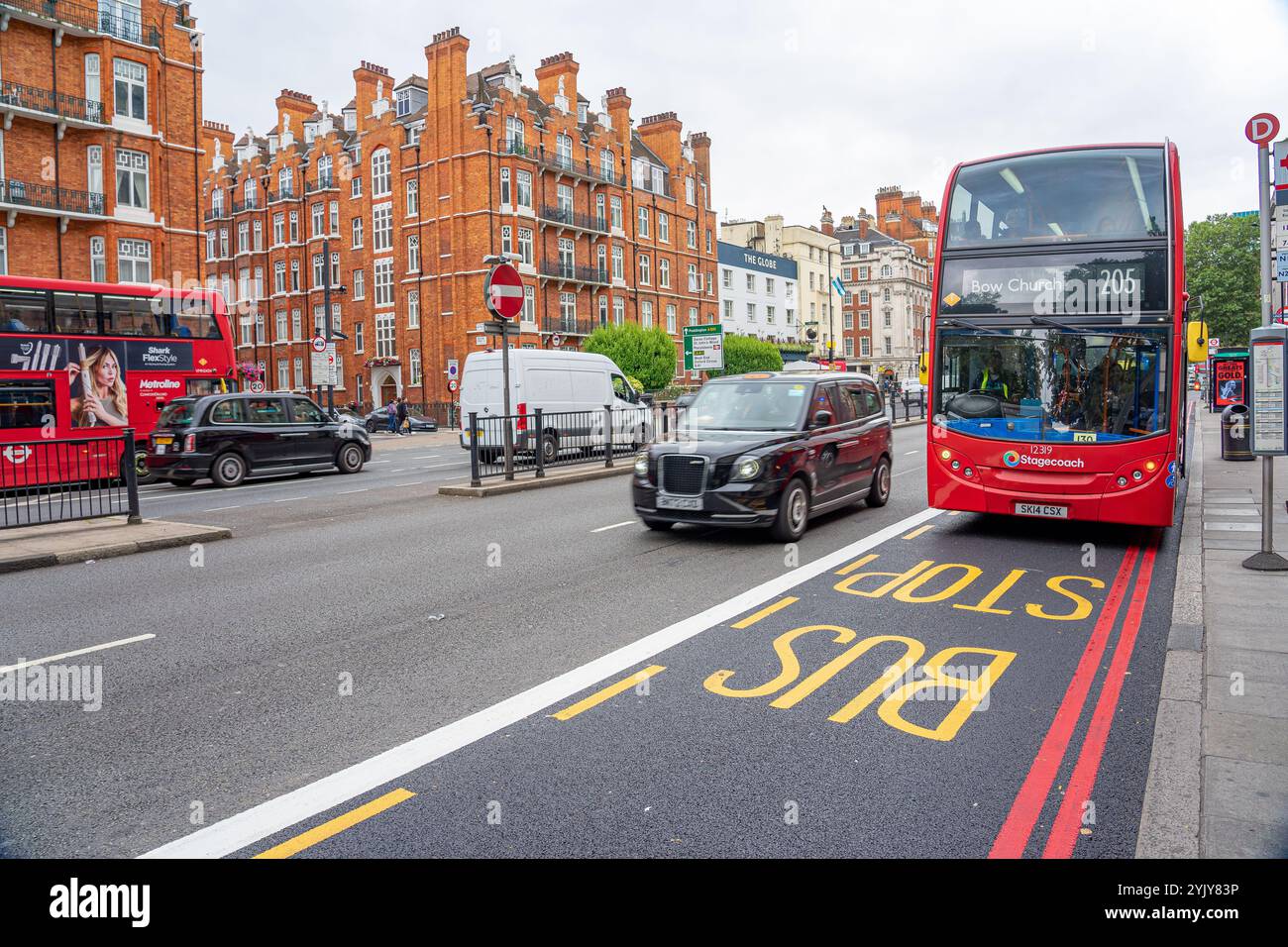 double decker bus approaching london bridge stop to drop off and pick ...
