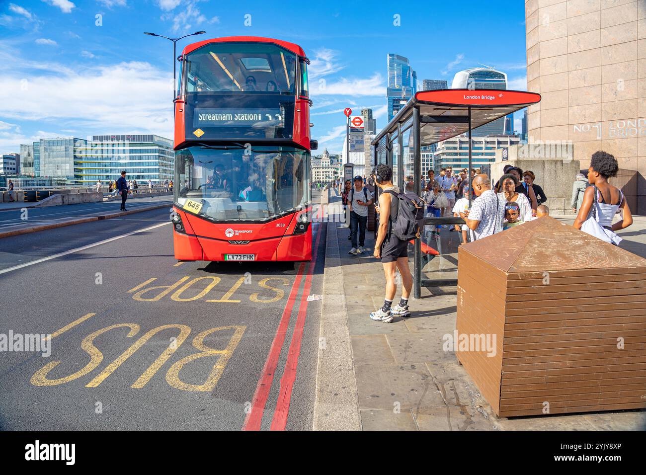 double decker bus approaching london bridge stop to drop off and pick ...