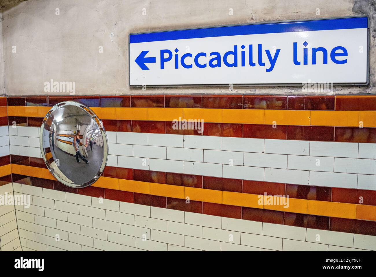 round mirror for pedestrian traffic inside a Piccadilly line tube ...
