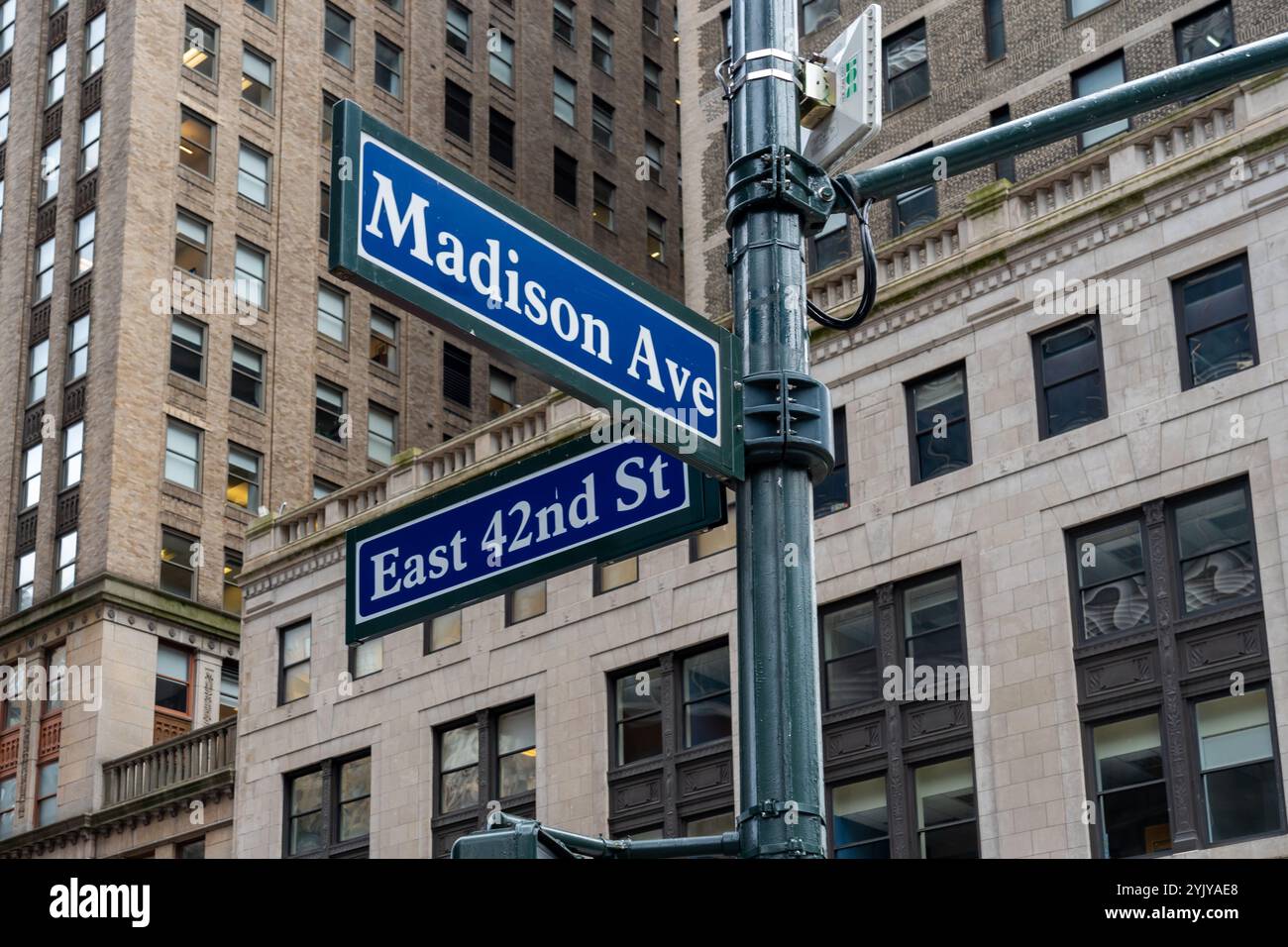 Close up of East 42nd and Madison Street sign is seen in New York City ...