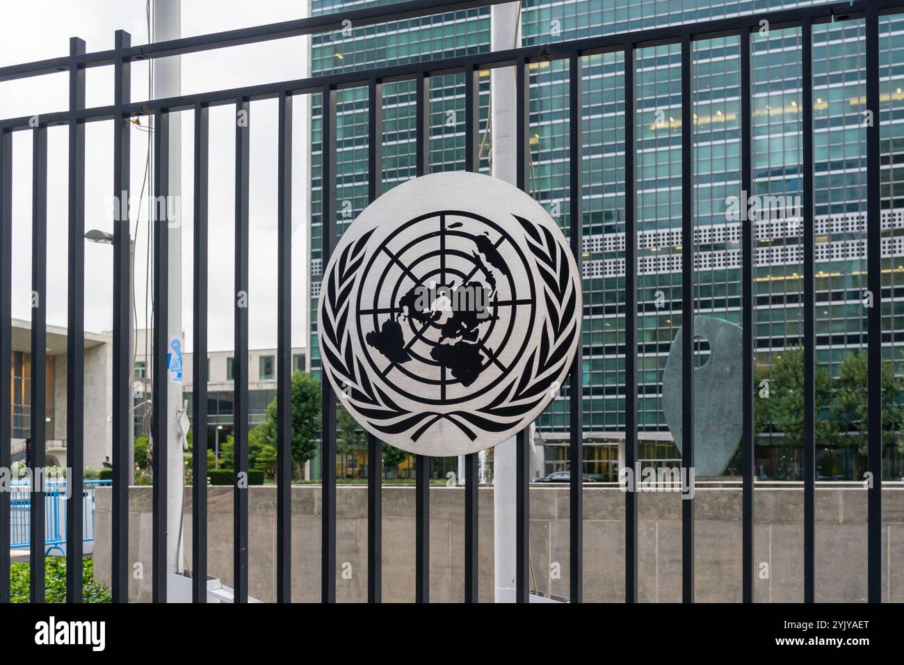United Nations logo on the fence outside its headquarters in New York ...
