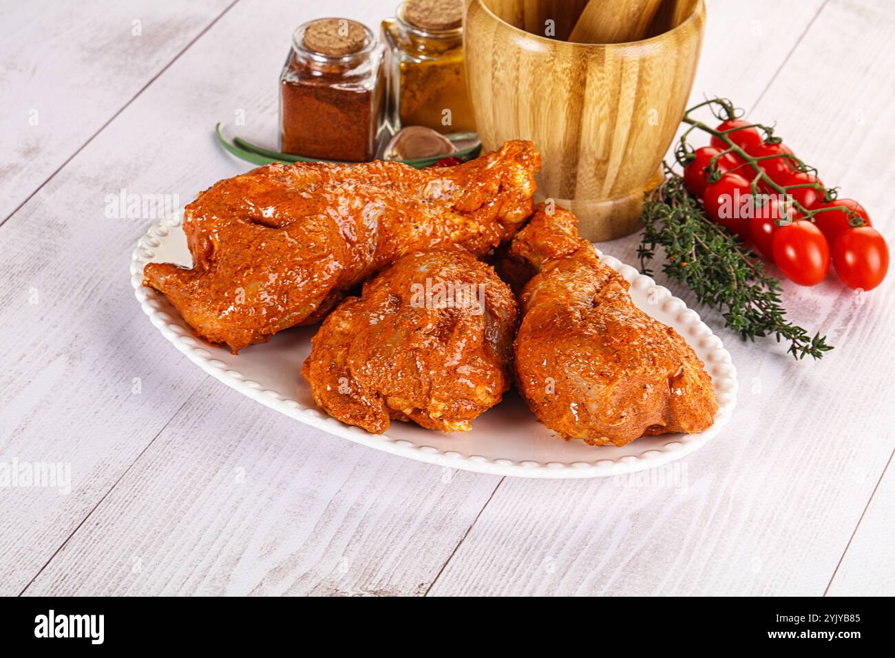 Raw turkey shoulder wing in Indian tandoori marinade spices Stock Photo ...