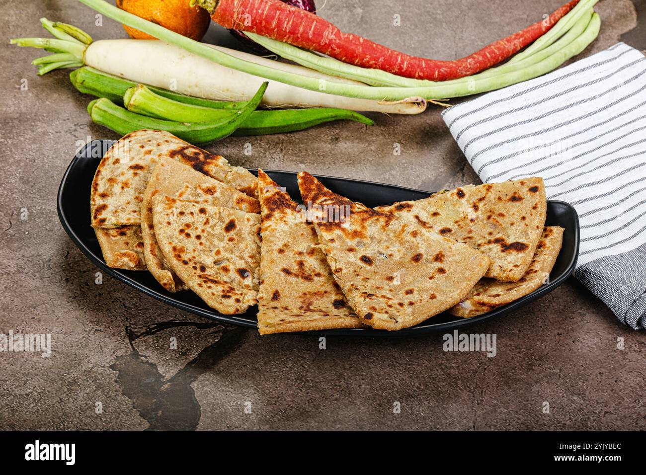 Indian vegetarian Aloo Paratha - bread with potato Stock Photo - Alamy