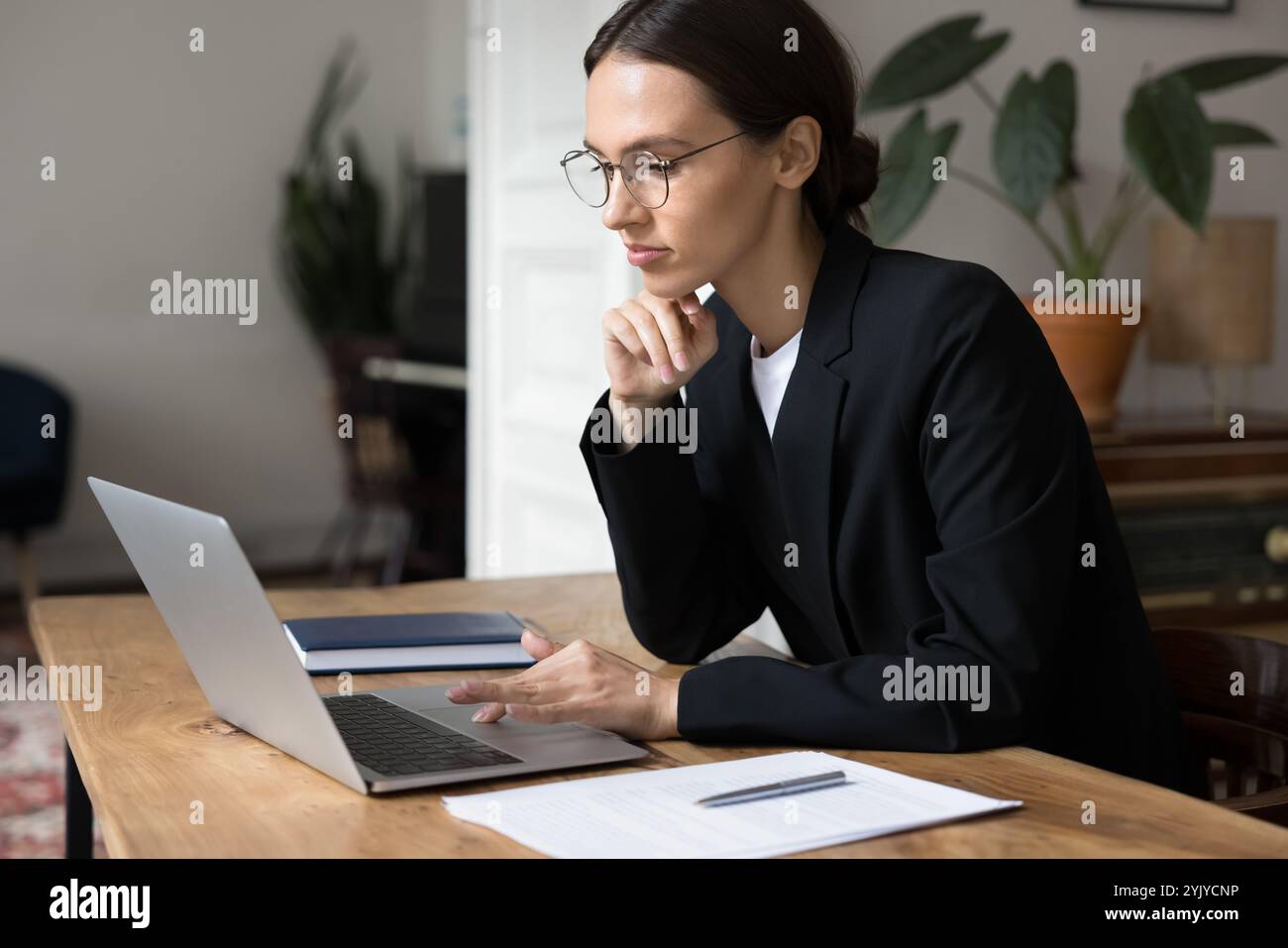 Hard working employee using computer hi-res stock photography and ...