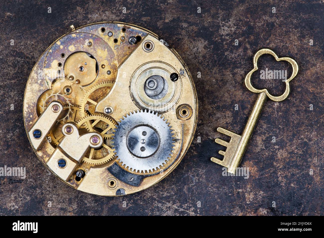 Golden clockwork with a key. Idea, creativity or brainstorming concept ...