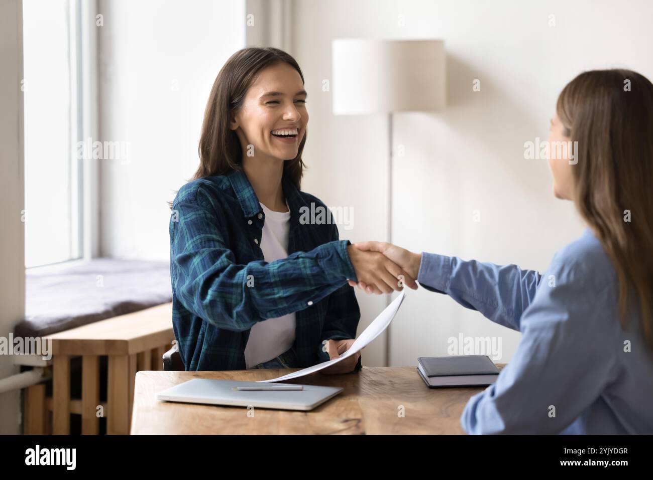 Women shaking hands congratulate each other with contract signing Stock ...