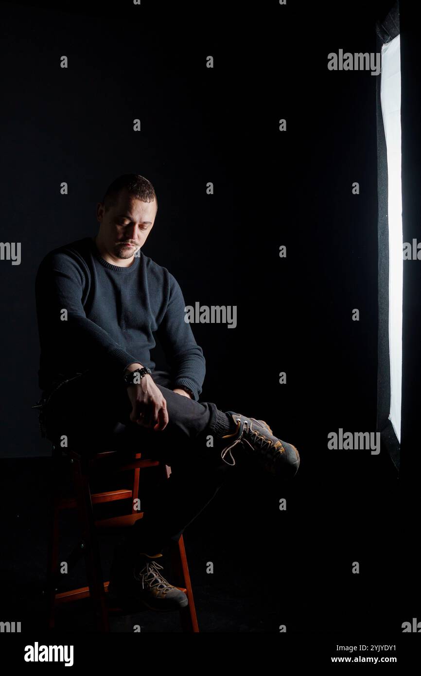 Dim light man hi-res stock photography and images - Alamy